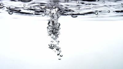 Blue scene of water splashing from left to right, generating waves and ...