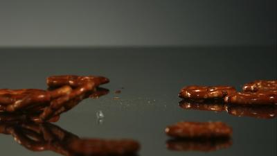 Pretzels falling and bouncing in ultra slow motion (1,500 fps) on a ...