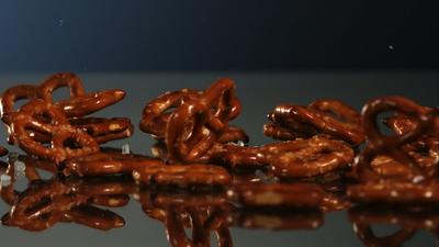Pretzels falling and bouncing in ultra slow motion (1,500 fps) on a ...